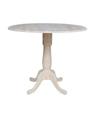 International Concepts 42" Round Dual Drop Leaf Pedestal Table In Cream ...