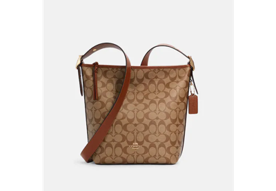 Coach Val Duffle In Signature Canvas In Brown | ModeSens