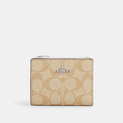Coach Outlet Bifold Wallet In Signature Canvas In Beige | ModeSens