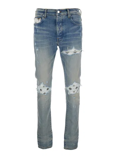 Amiri Light Blue Jeans With Ribbed Details On The Front And Logo Patch ...