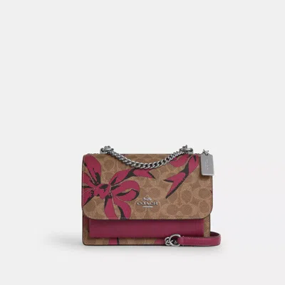 Coach Outlet Klare Crossbody Bag In Signature Canvas With Bow Print In ...
