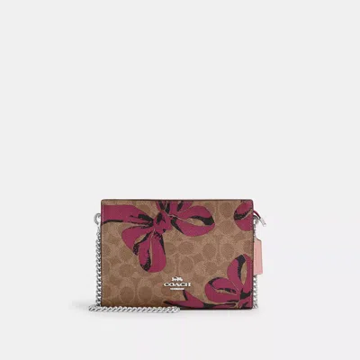 Coach Slim Crossbody Bag In Signature Canvas With Bow Print In Pink ...
