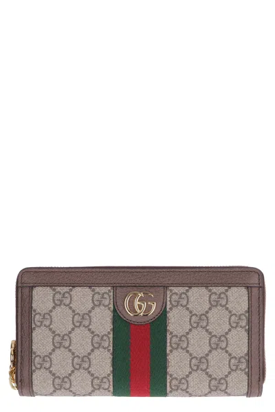 Gucci Mini Zip Around Wallet With Web Detail In Tan | ModeSens