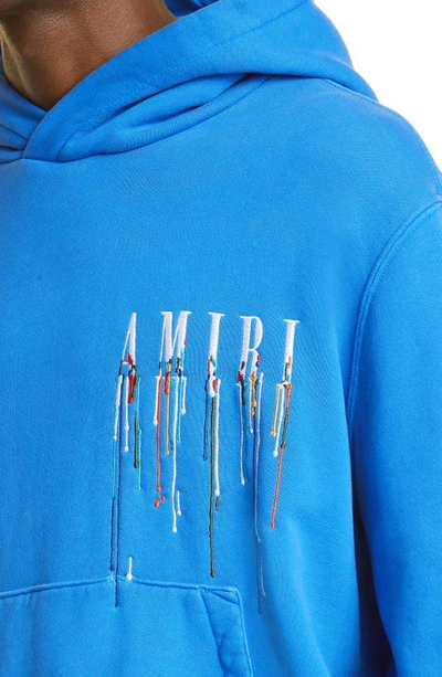 Amiri Paint Splatter Logo-embroidered Hoodie In Blue | ModeSens