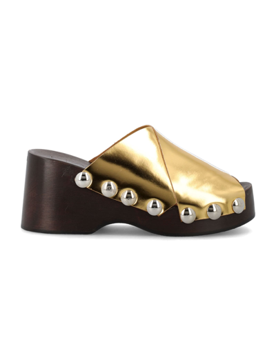 Ganni Embellished Metallic Leather Clogs In Gold | ModeSens