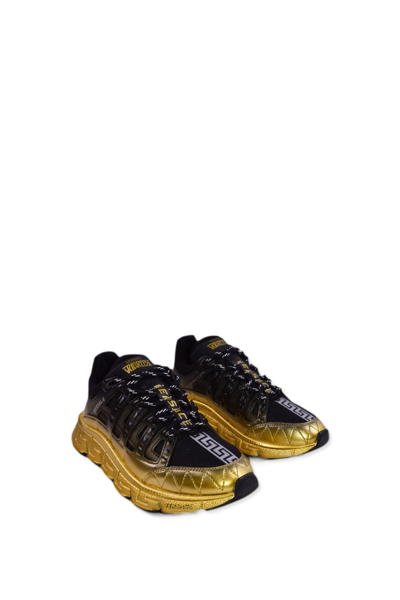 Versace Trigreca Sneakers In Black Gold | ModeSens
