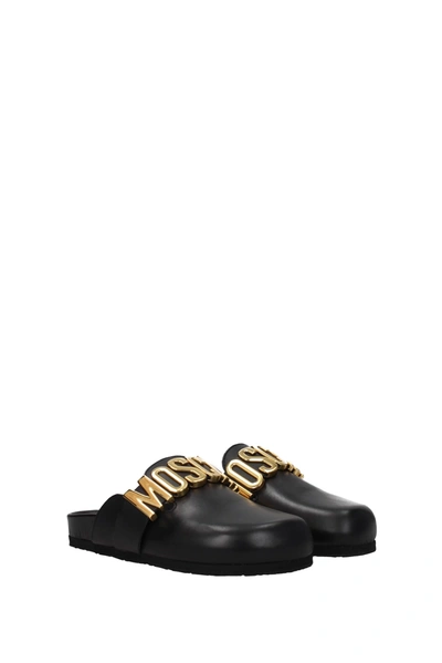 Moschino Slippers And Clogs Leather Black Gold | ModeSens